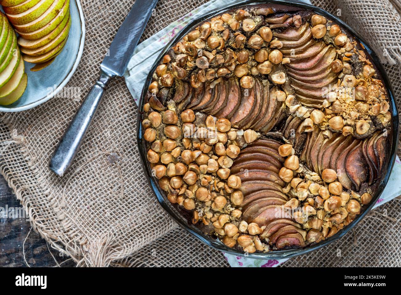 Moist chocolate, pear and golden hazelnut torte - overhead view Stock ...