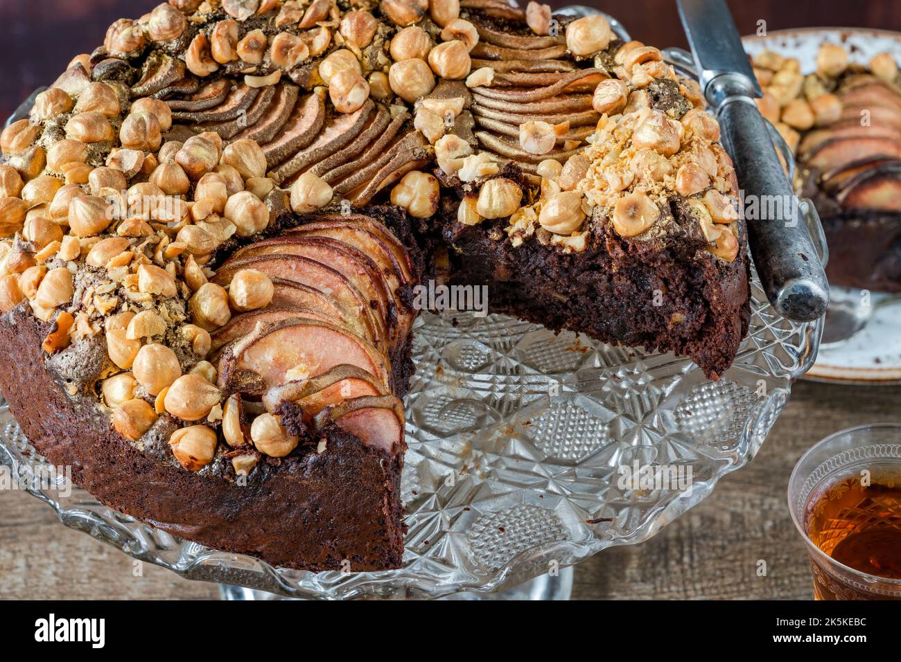 Moist chocolate, pear and golden hazelnut torte Stock Photo - Alamy