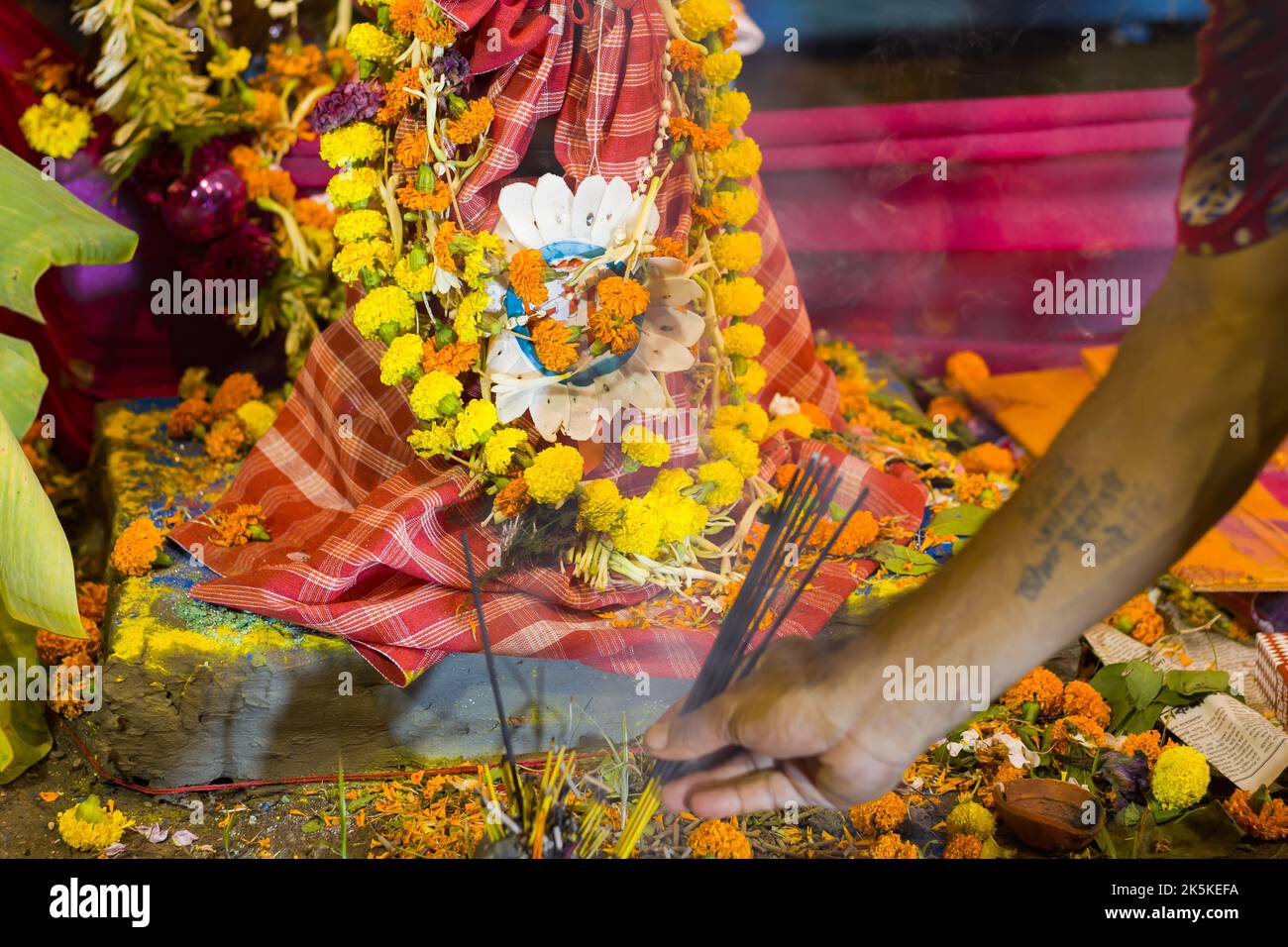 Hindu puja rituals with flowers, cloth and other condiments required ...