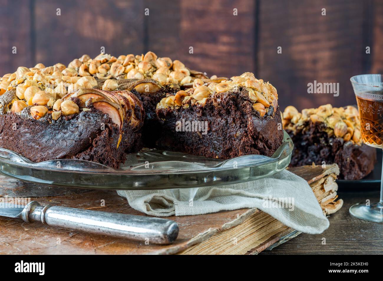 Moist chocolate, pear and golden hazelnut torte Stock Photo - Alamy