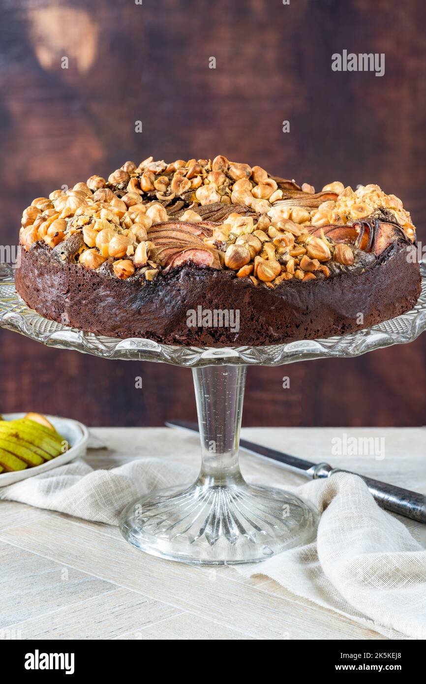 Moist chocolate, pear and golden hazelnut torte Stock Photo - Alamy