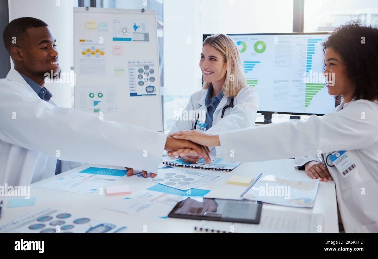 Hands, teamwork and planning of doctors with charts, graphs or ...