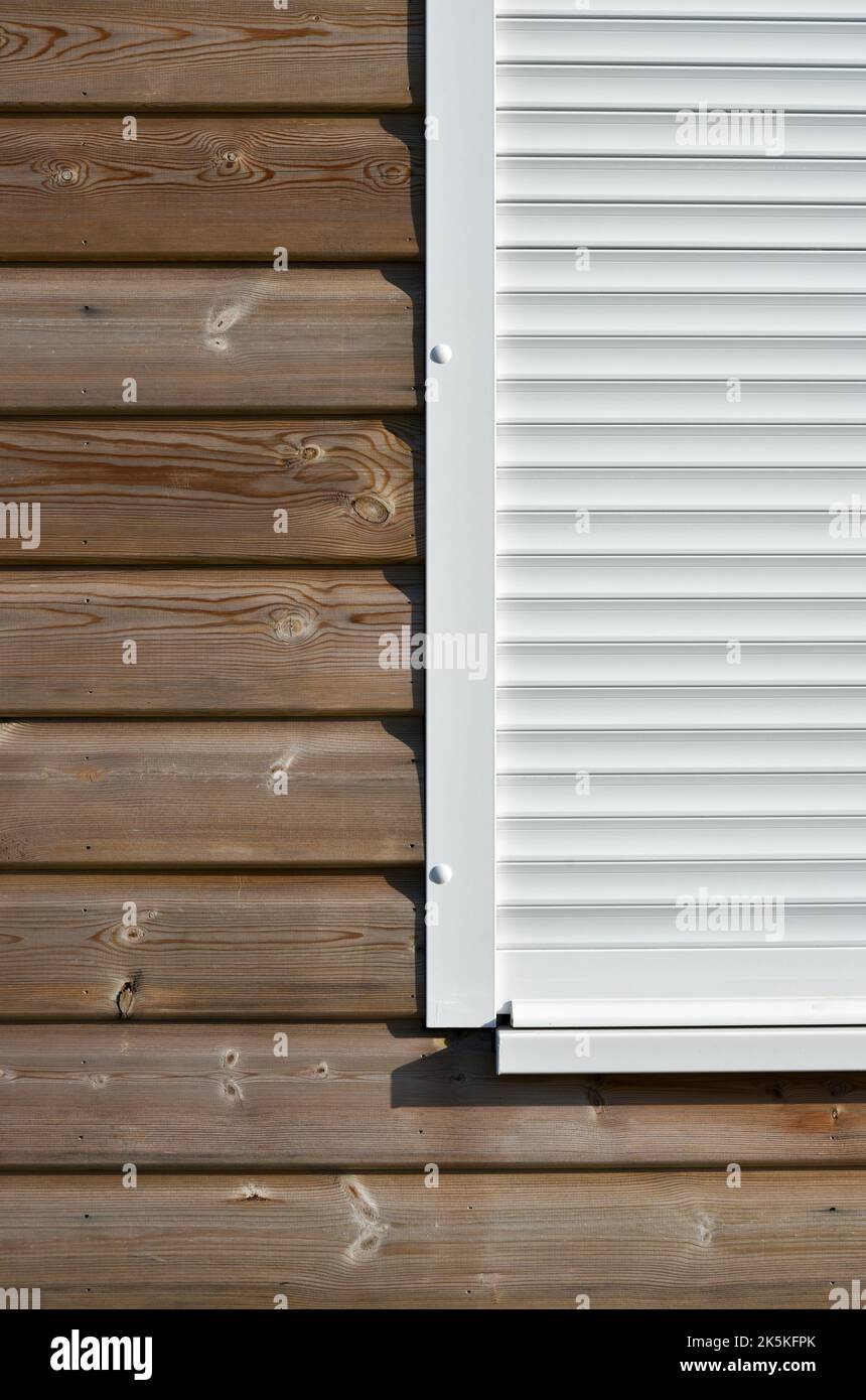 Abstract image, the edge of a bright white shutter window against the ...