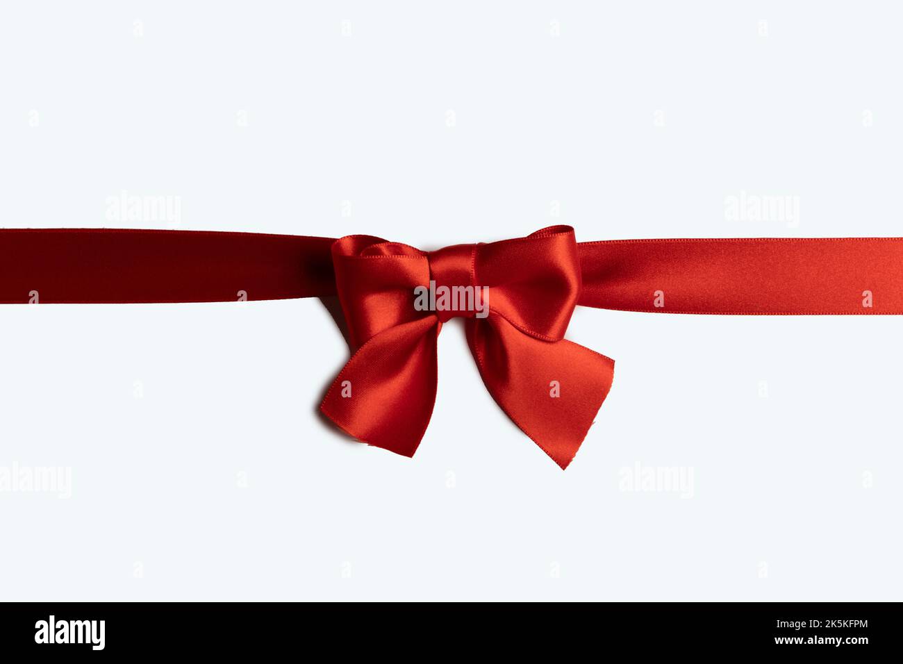 Elegant satin red ribbon bow isolated on white background Stock Photo ...