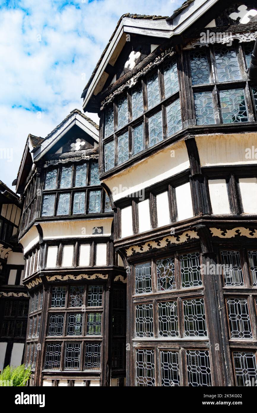 exterior of Tudor half timbered moated National Trust house Little ...