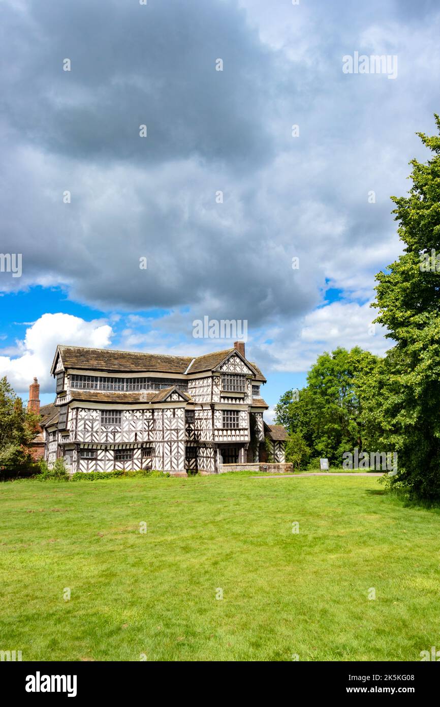 exterior of Tudor half timbered moated National Trust house Little ...