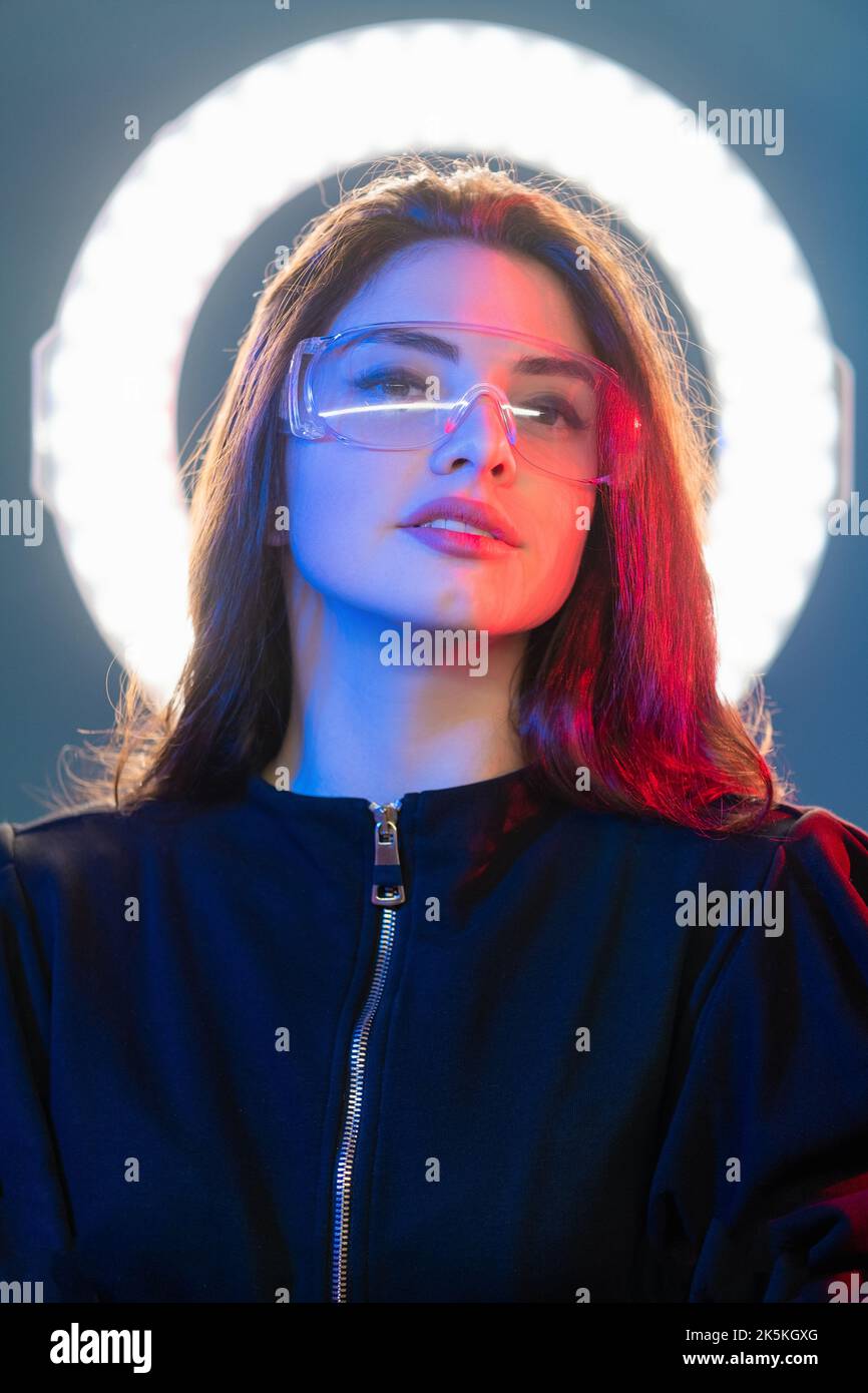 Futuristic portrait. Cyberpunk beauty. Sci-Fi technology. Confident red ...