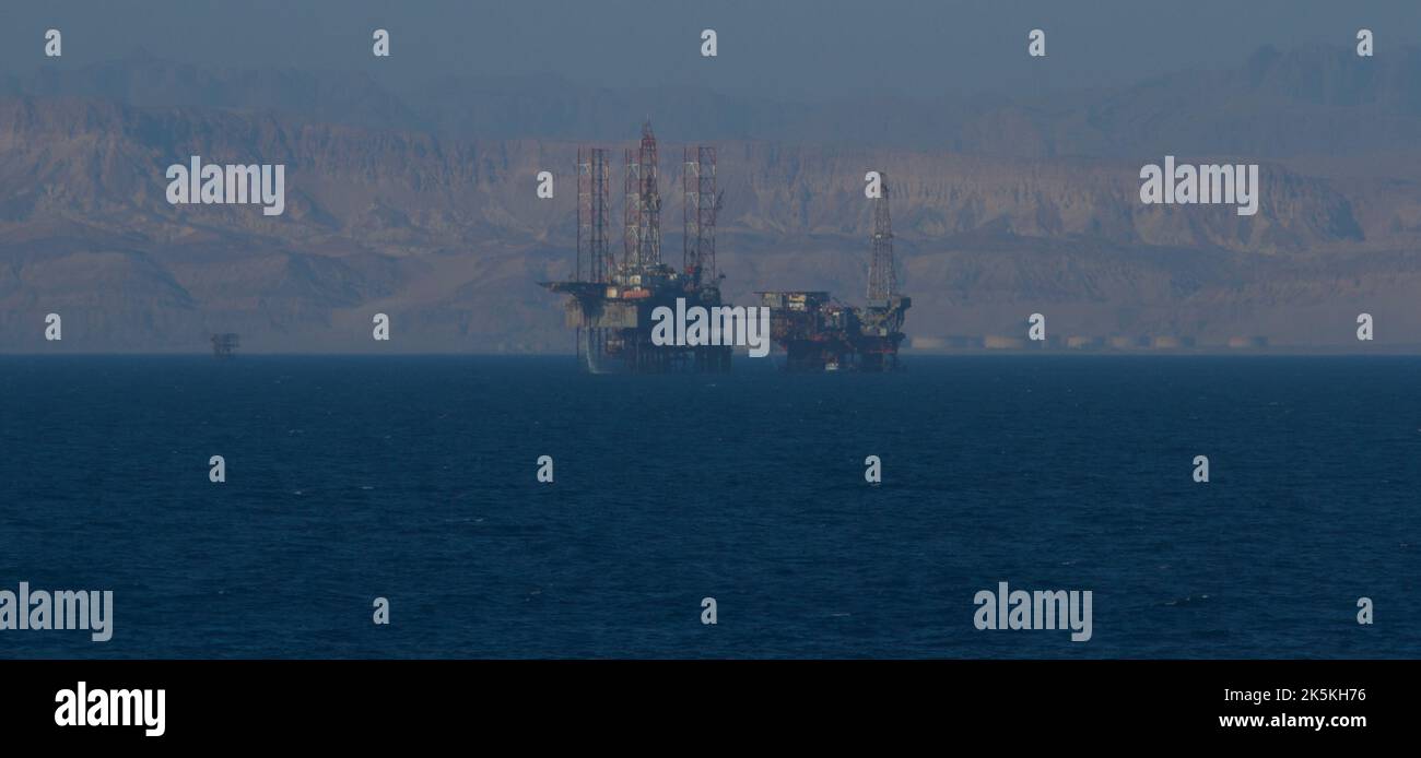 Oil drilling platform in the red sea with Sinai mountains in the ...