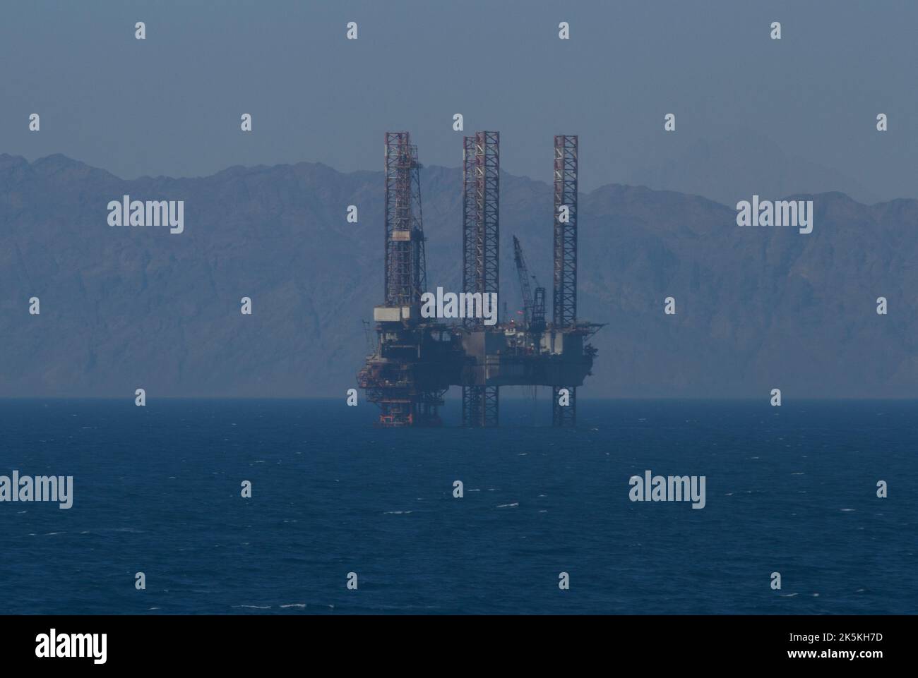 Oil drilling platform in the red sea with Sinai mountains in the ...