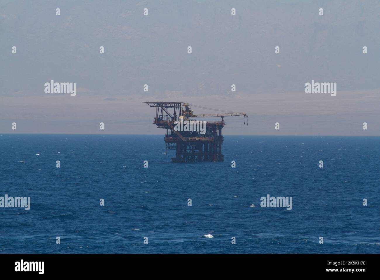 Oil drilling platform in the red sea with Sinai mountains in the ...