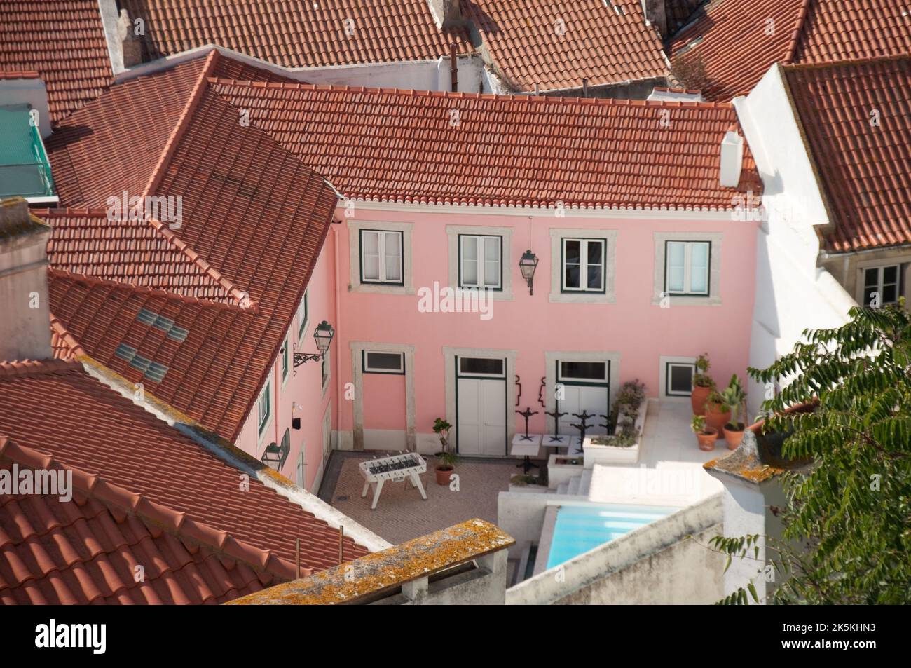 View of Lisbon rooftops and an inner courtyard from St George's Castle ...