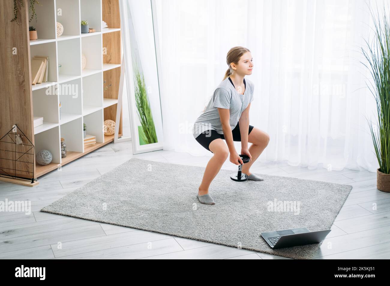 child home sport fitness online girl exercise Stock Photo - Alamy