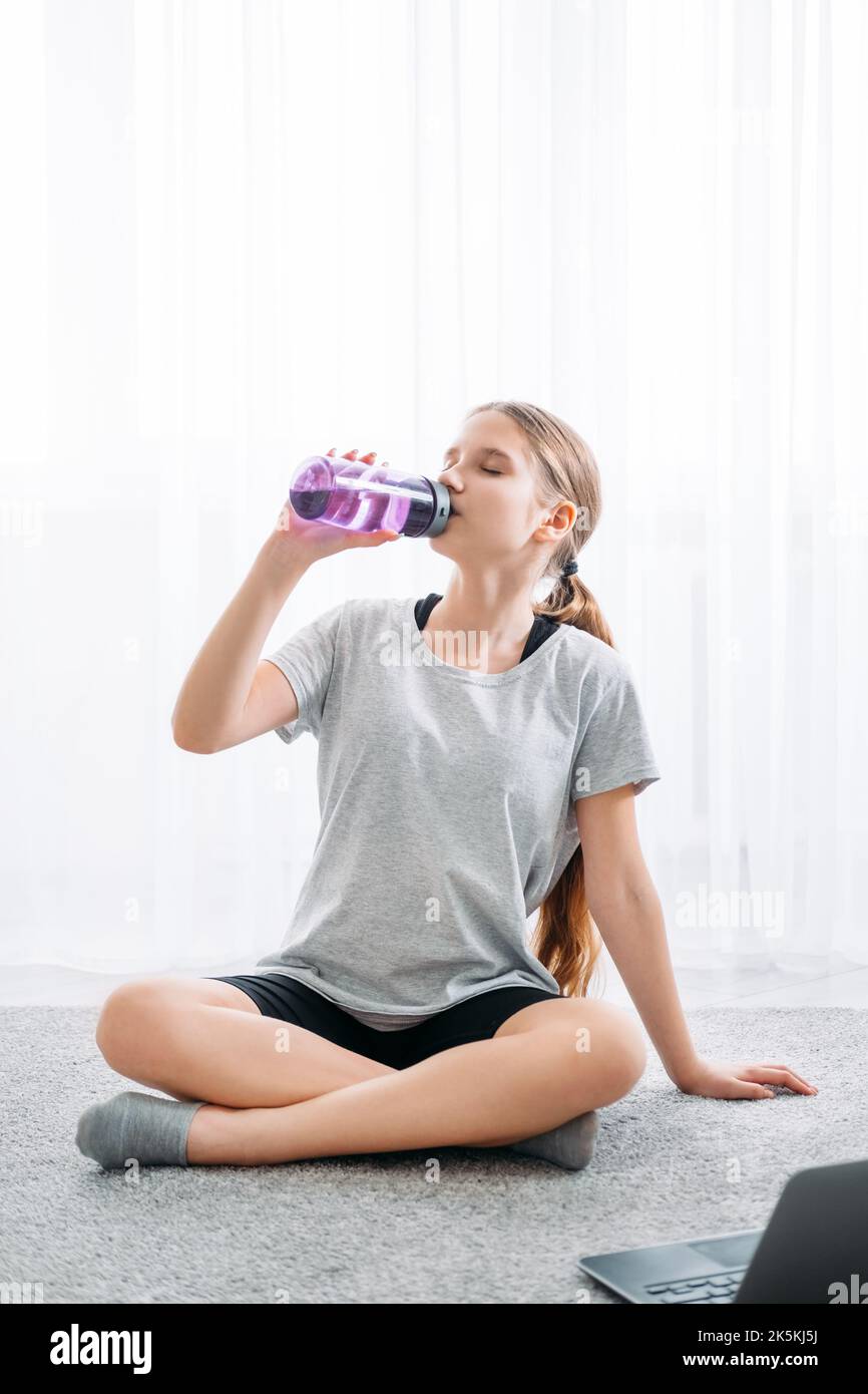 fitness hydration home gym girl drinking water Stock Photo - Alamy