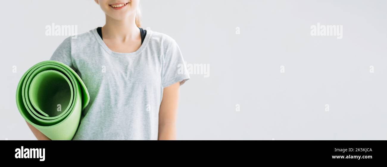 kids yoga fitness banner sport girl with yoga mat Stock Photo - Alamy