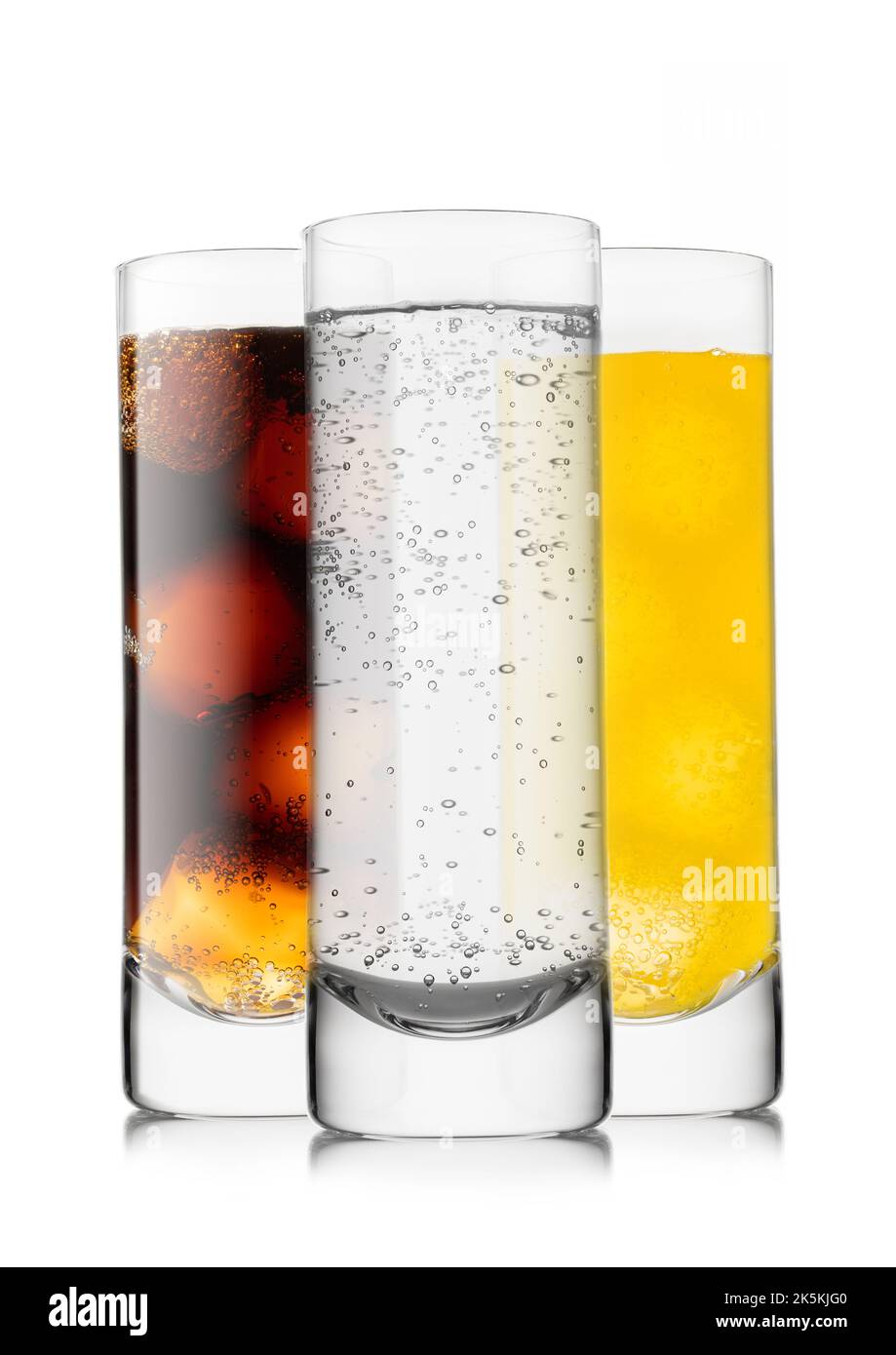 Lemonade soft drink with cola and orange soda with ice cubes in highball glasses on white Stock ...