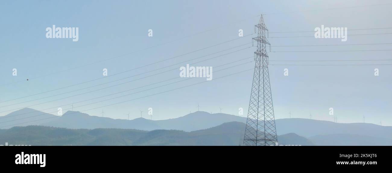 High voltage post or High voltage tower on background mountains with ...