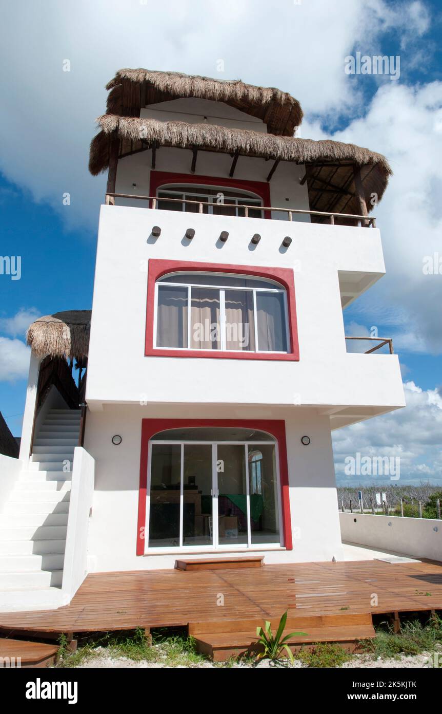 The residential house with a straw roof in Mahahual resort town (Costa ...