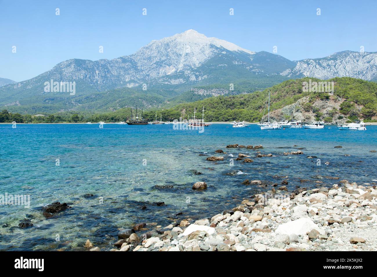 The view of Phaselis ancient city inlet with Tahtali (Olympos) Mountain ...