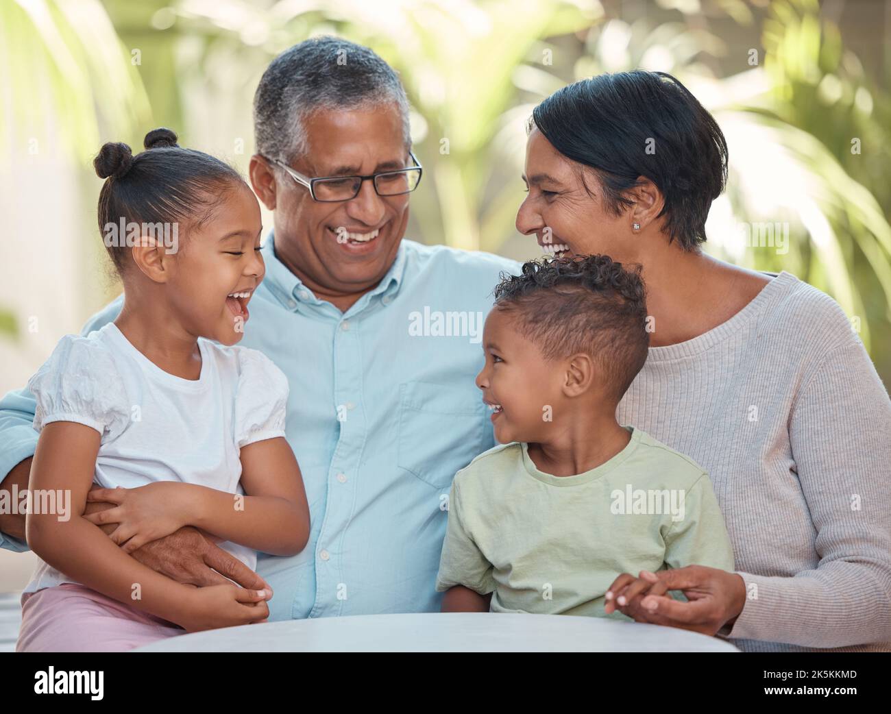 Love, family and happy grandparents with children siblings bonding ...