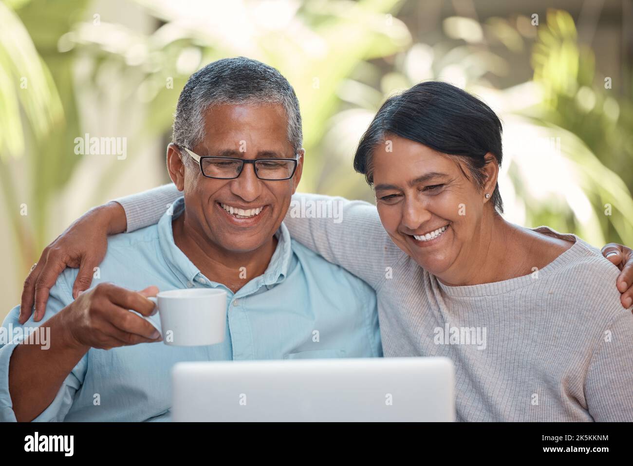 Video call, coffee garden and senior couple in communication with ...