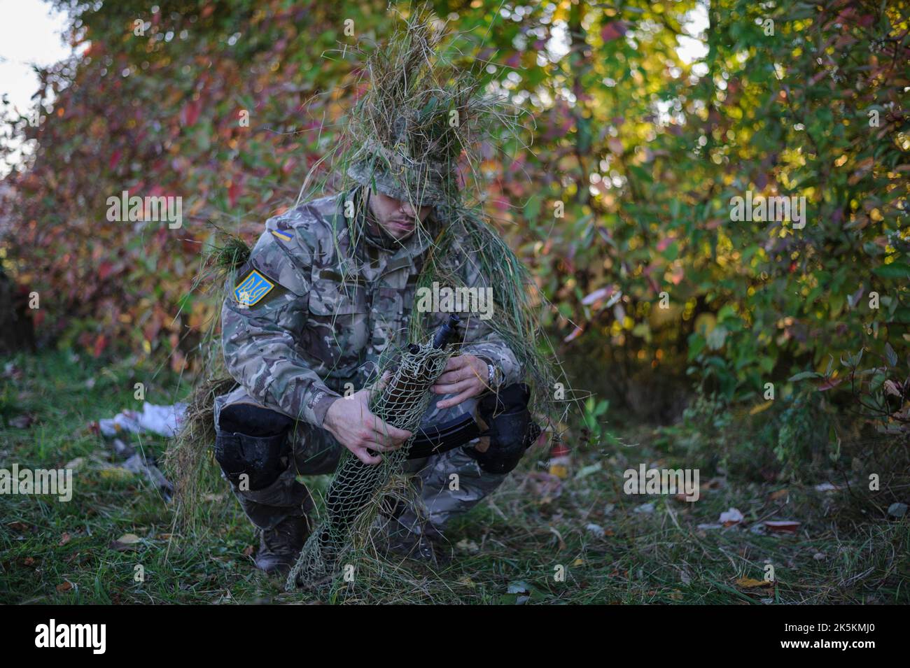 Civilian learns masking techniques during the Military training. Russia ...