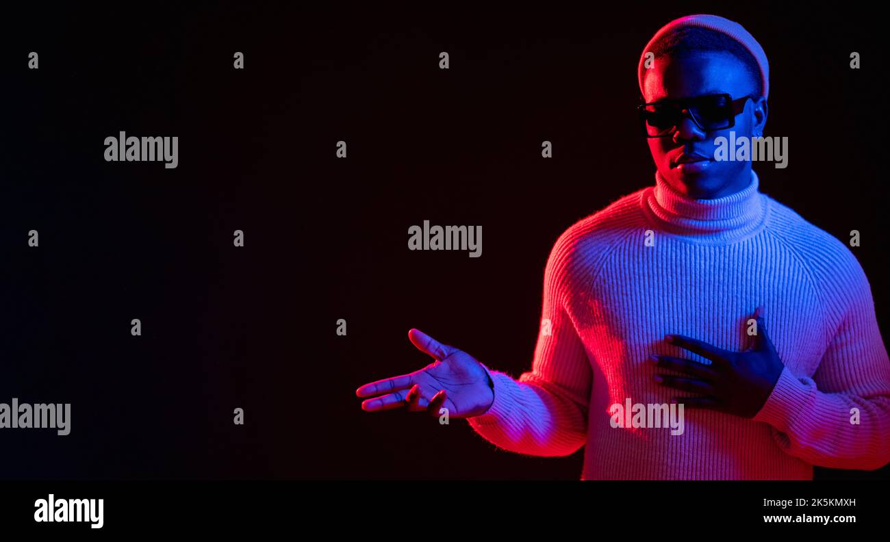 pointing man neon light banner offer advertising Stock Photo - Alamy