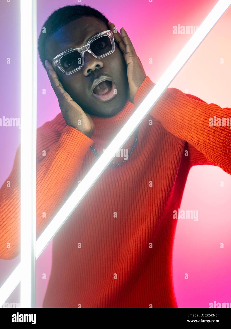surprised man omg expression wow face neon light Stock Photo - Alamy