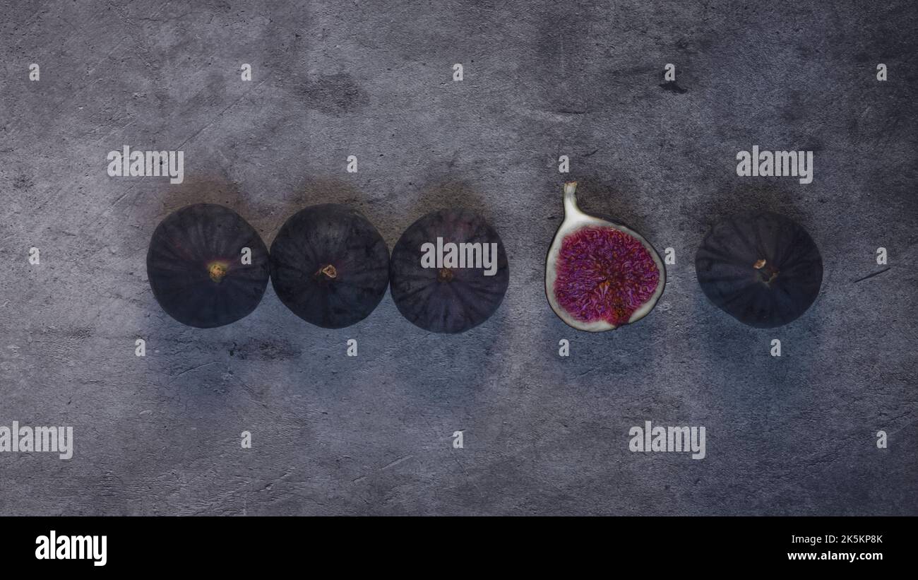 Fig cut in half with figs in row Stock Photo - Alamy