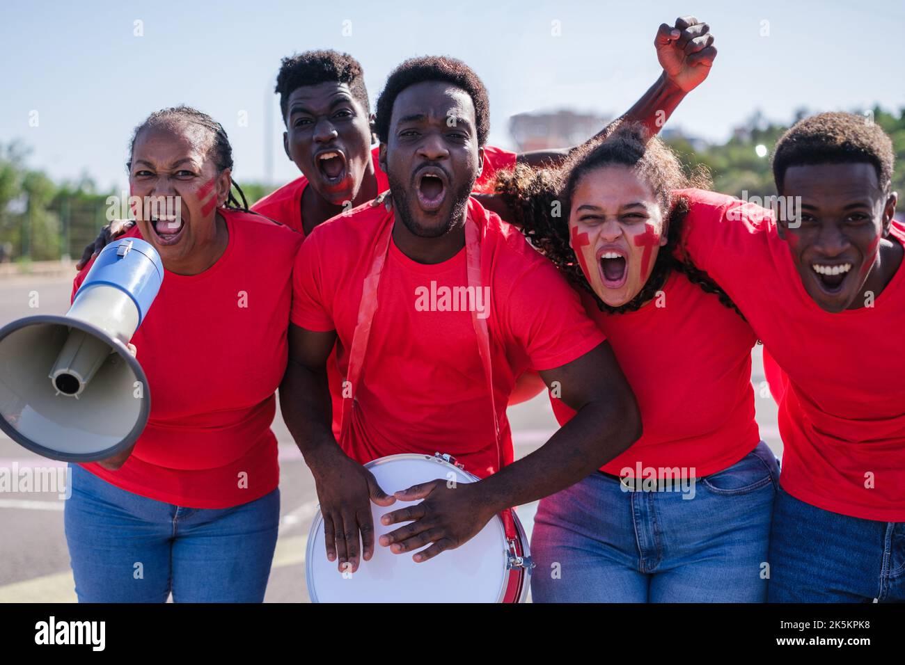 Soccer fans cheering on their team in the competition for national ...