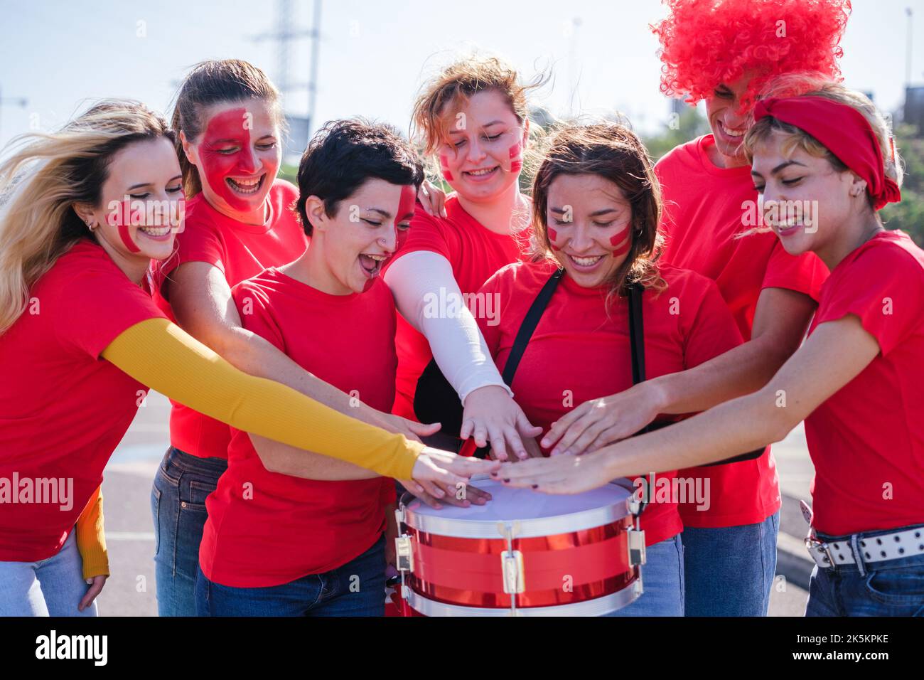 group of fans together cheering and defending their team with joy and ...
