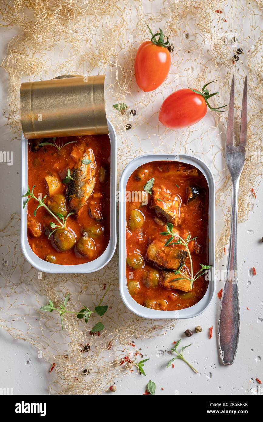 Tasty and fresh sprats in tomato sauce and capers. Sprats in can with ...