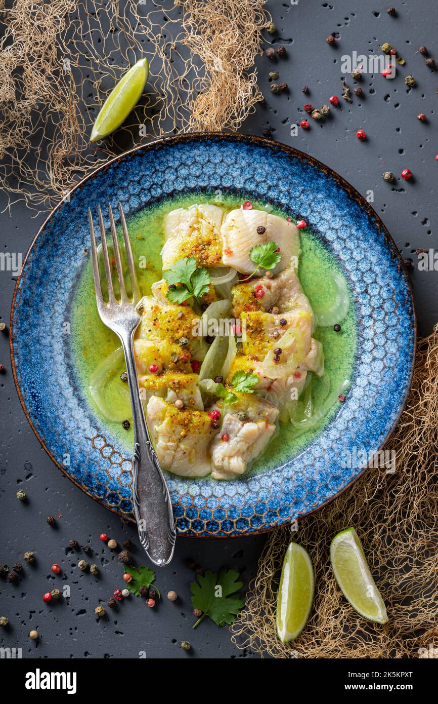 Tasty pickled fish as popular Polish snack. Fish pickled with oil and ...