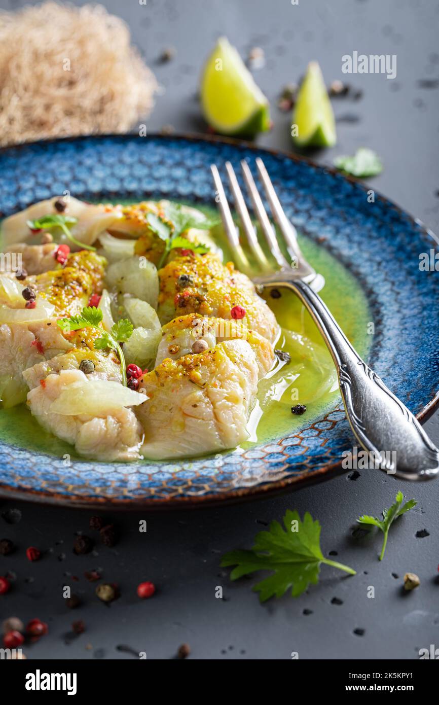 Healthy marinated herring in oil with onions and pepper. Fish pickled ...