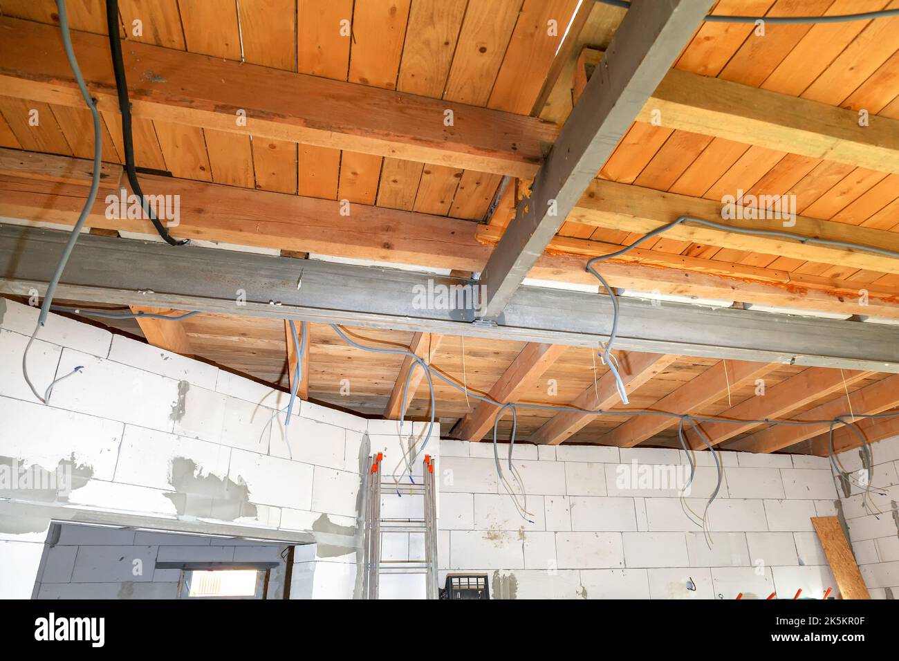 Construction of a residential building. The metal beam supports the ...