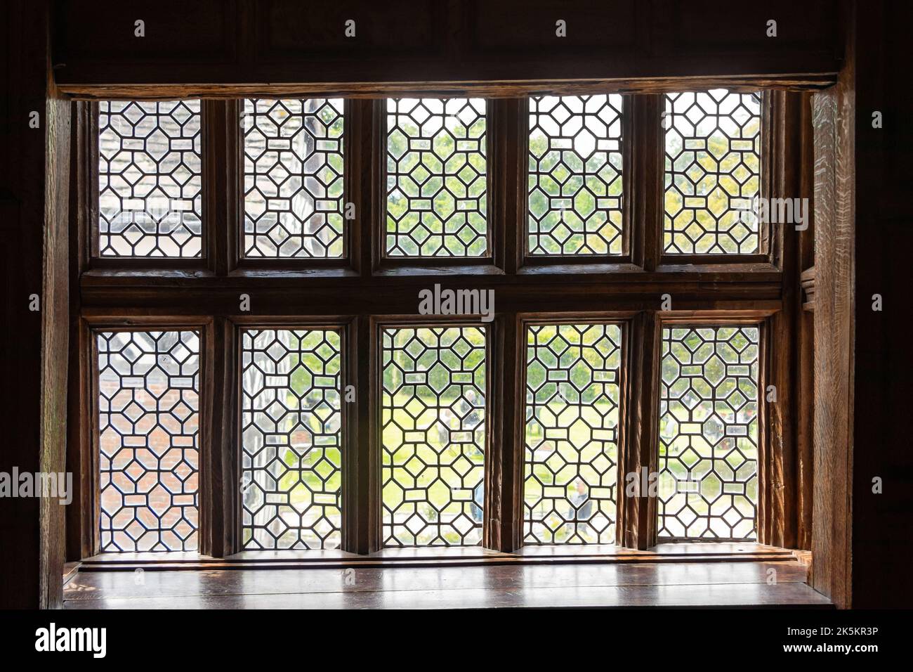 stained glass leaded window of Tudor half timbered moated National ...