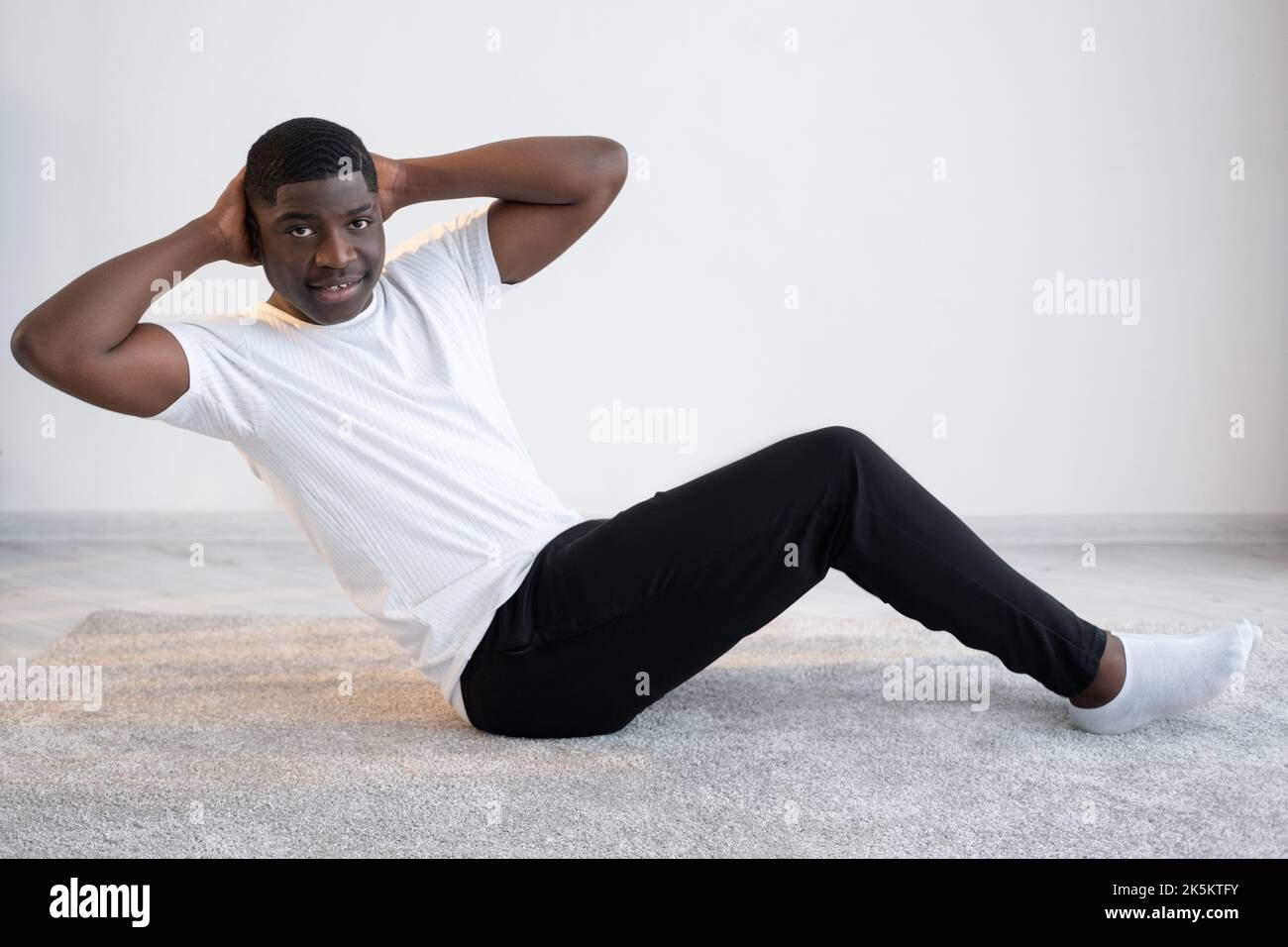 athletic black man fitness gym home training Stock Photo - Alamy
