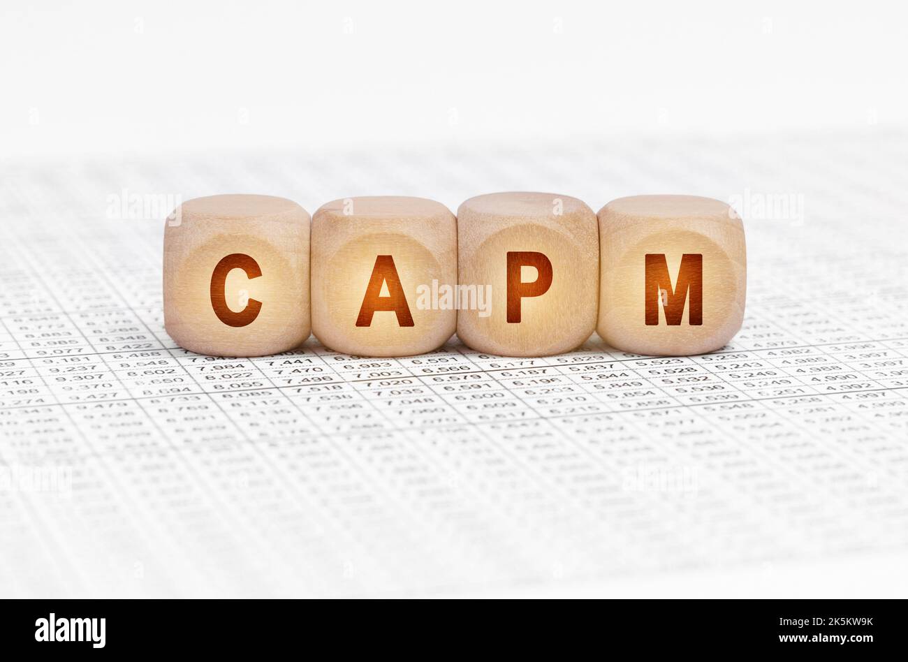 Business concept. On the table with documents are wooden cubes with the ...