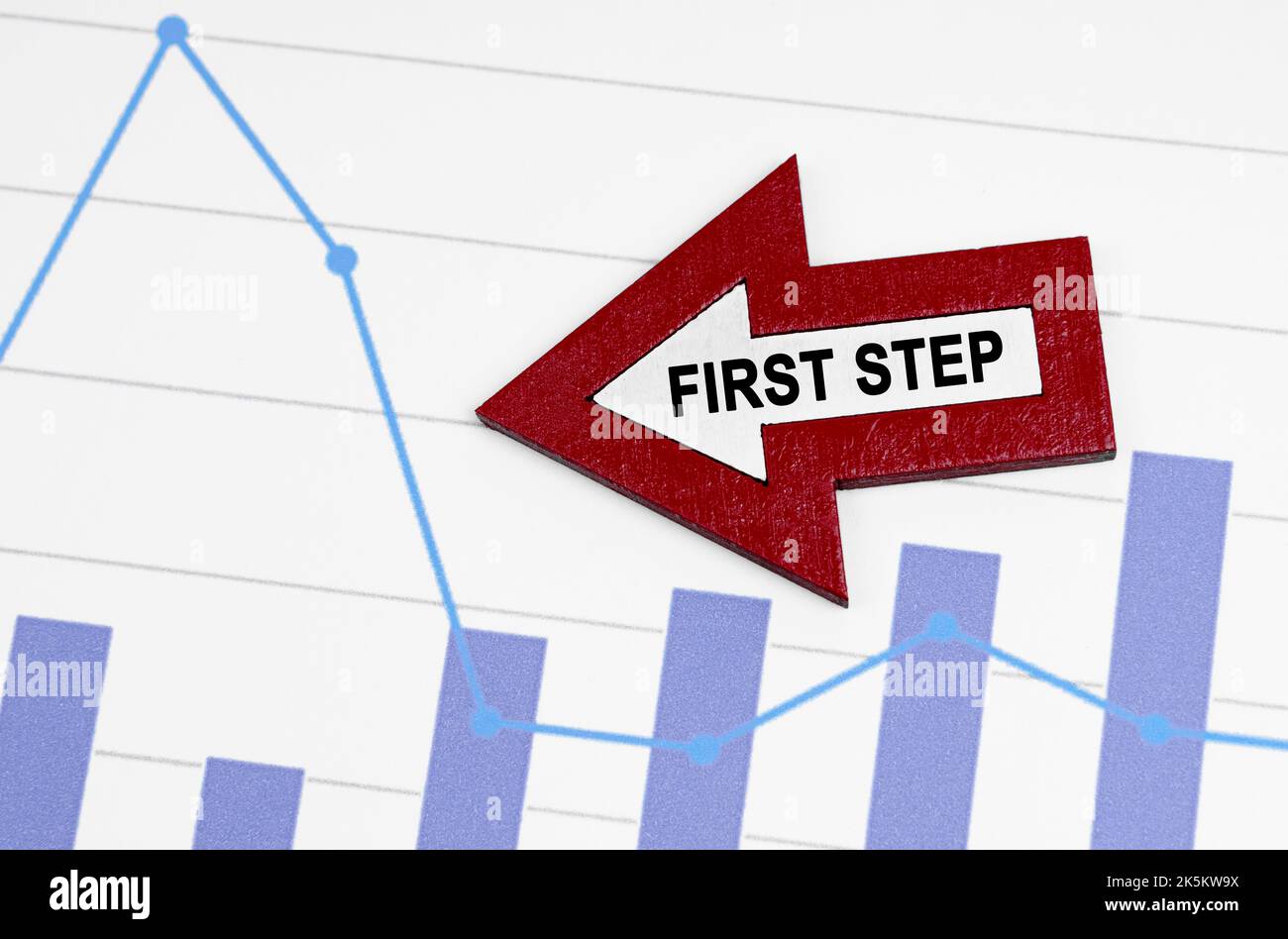 Business concept. On the reporting chart there is an arrow with the ...