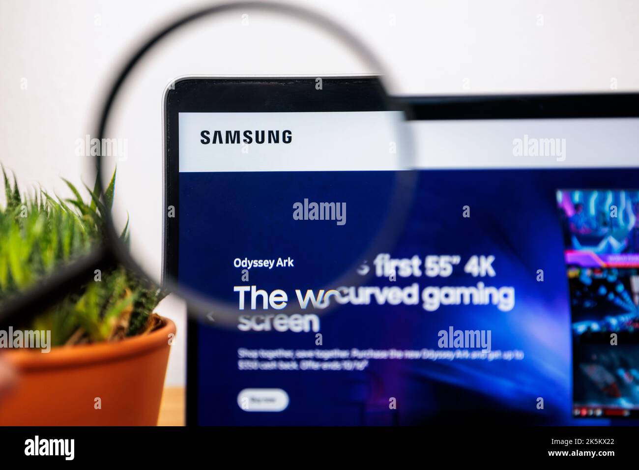A display of the Samsung website on a laptop screen and the Samsung ...