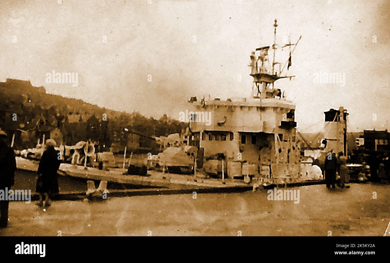 A circa 1950's photograph of the former H.M.S. Whitby moored in the ...