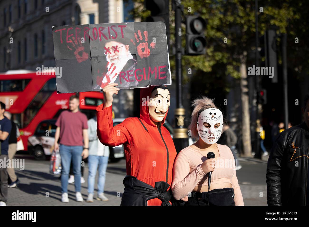 London, UK. 08th Oct, 2022. Protesters seen wearing costumes from Money ...