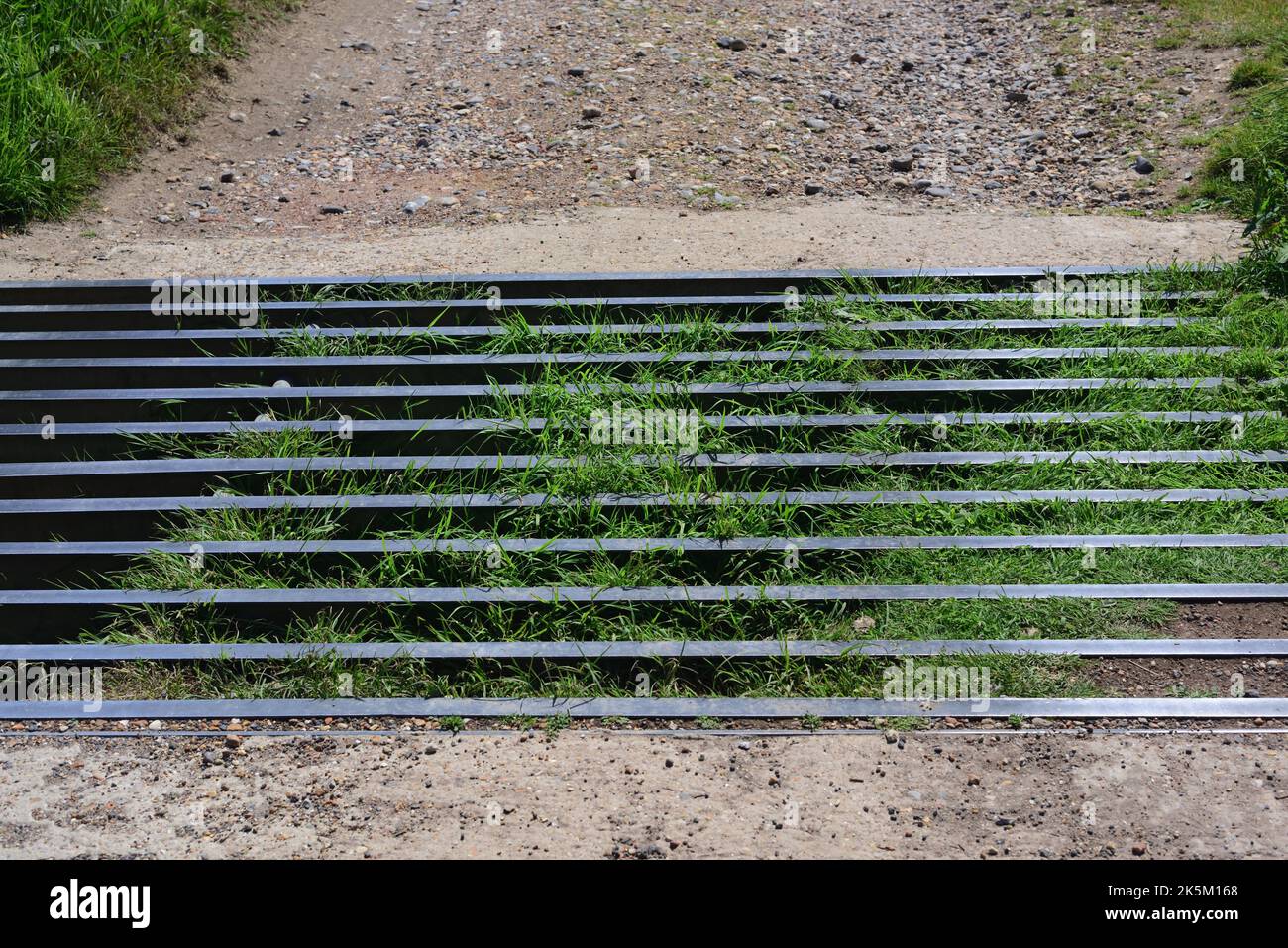 Stop barrier to an open field hi-res stock photography and images - Alamy