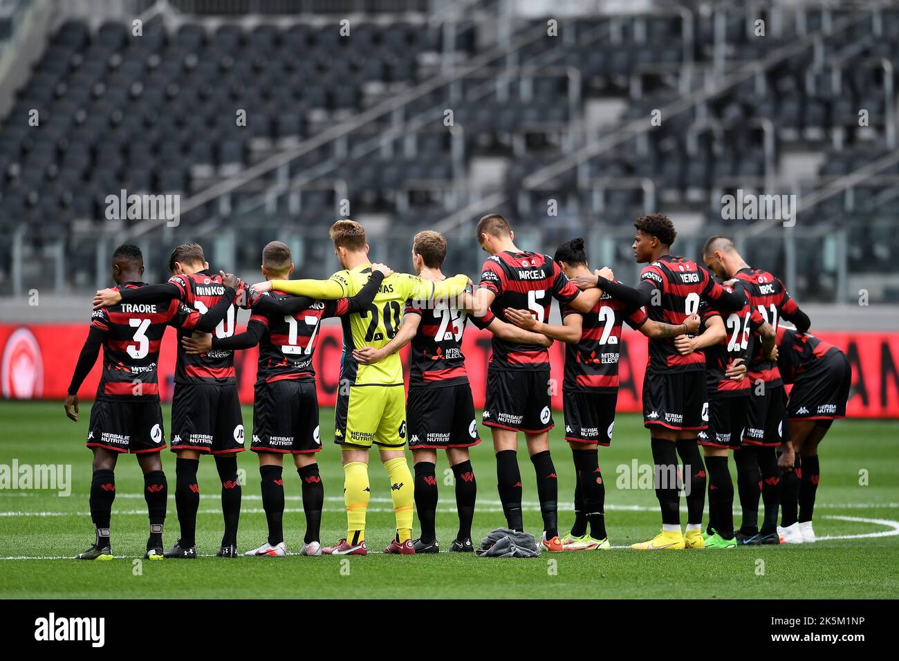 SYDNEY, AUSTRALIA - OCTOBER 09: Western Sydney stand in tribute to the ...