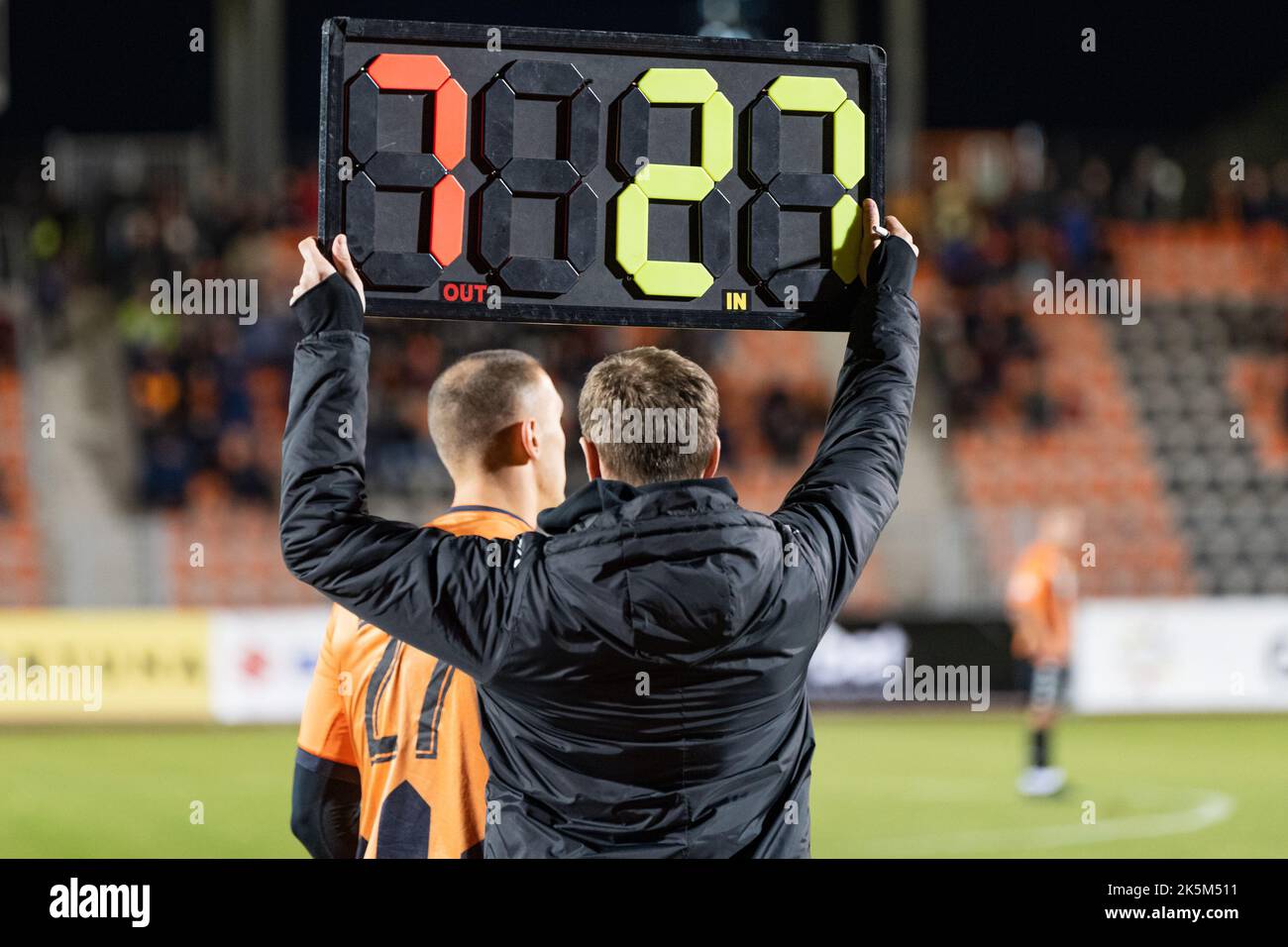 Man shows players substitution during football match Stock Photo - Alamy