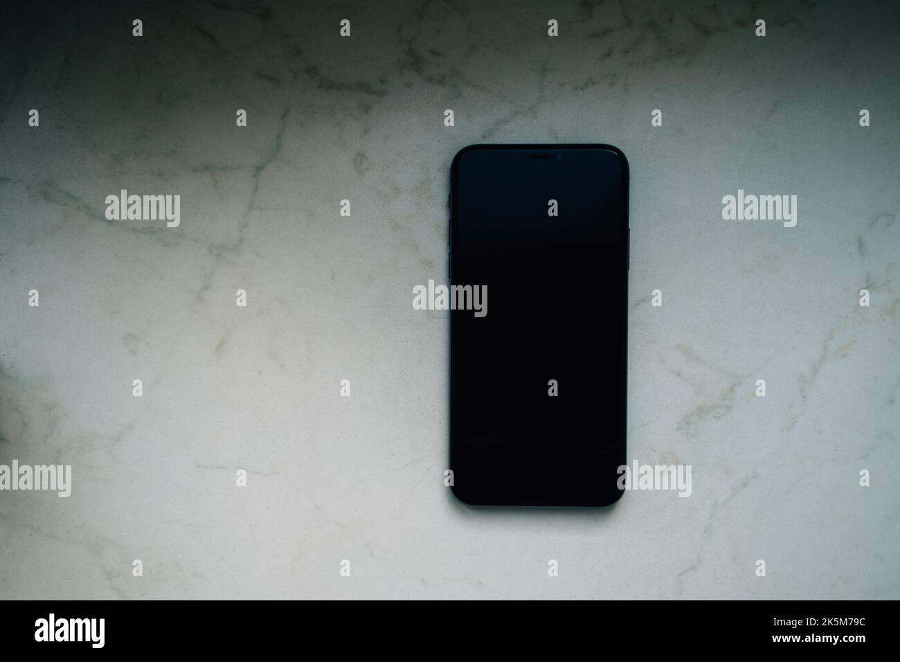A black smartphone on white background Stock Photo - Alamy