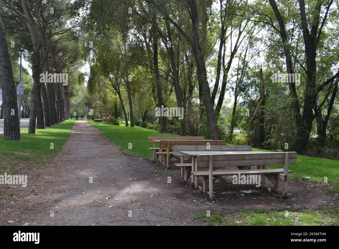 Beautiful panoramic green landscape with wide sandy sidewalk in green ...