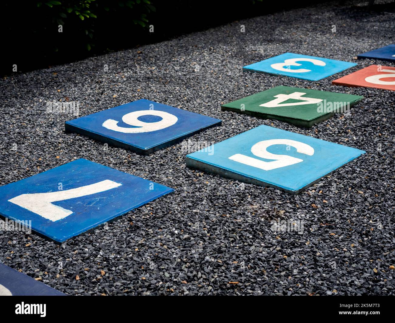 Number 7 on multicolored hopscotch on the asphalt ground in the kids ...