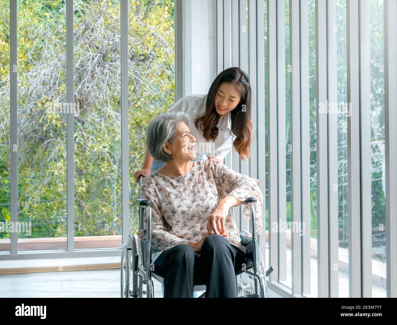 Happy Asian elderly woman, mother or grandparents on wheelchair taking ...