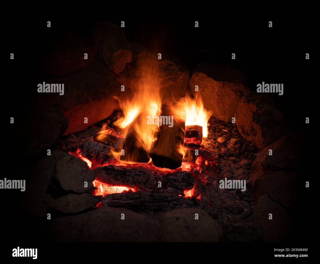 Rock ring around a warm campfire to prevent sparks escaping Stock Photo ...