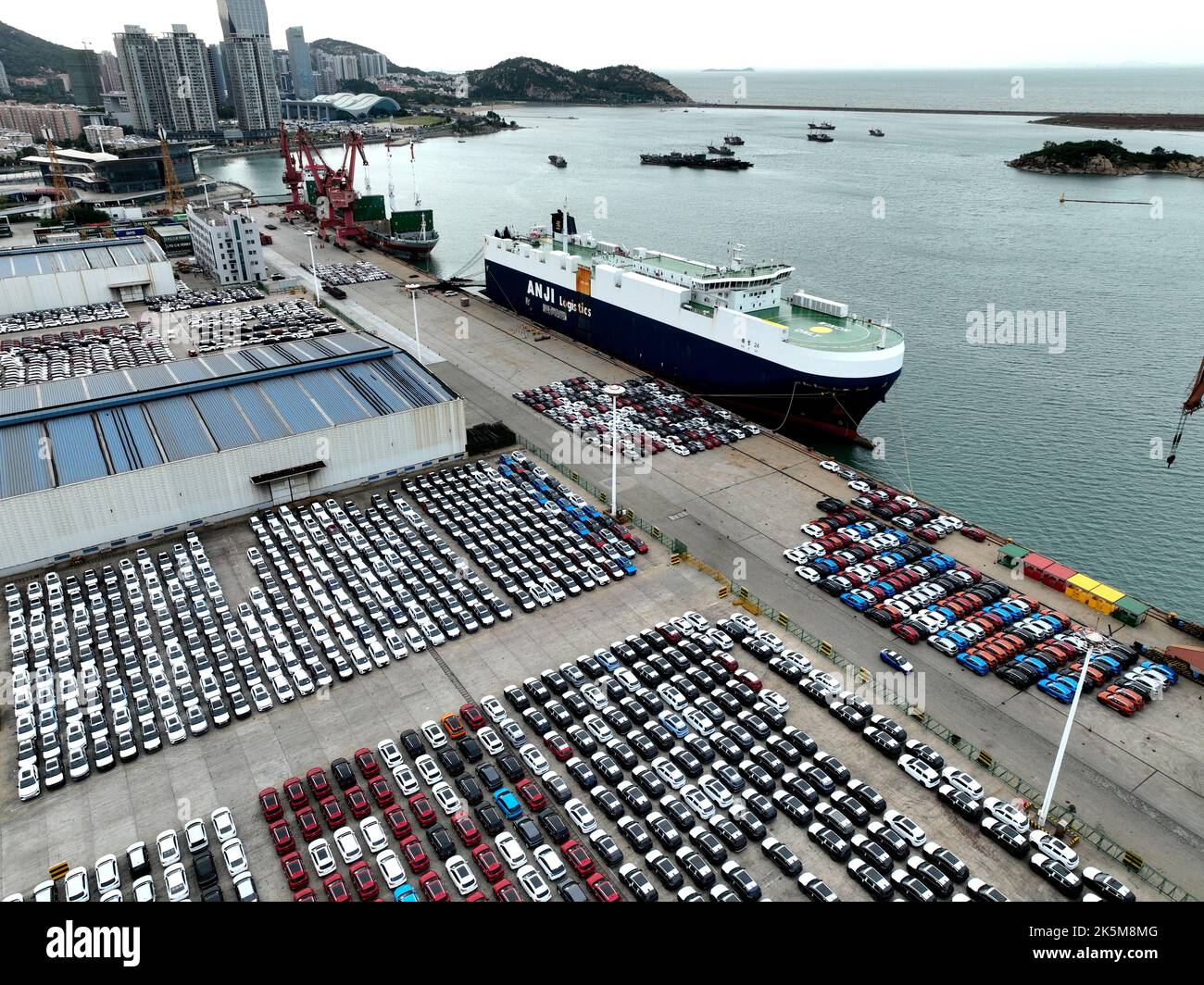 LIANYUNGANG, CHINA - OCTOBER 9, 2022 - Ro-ro wheels load export vehicles at the wharf of ...